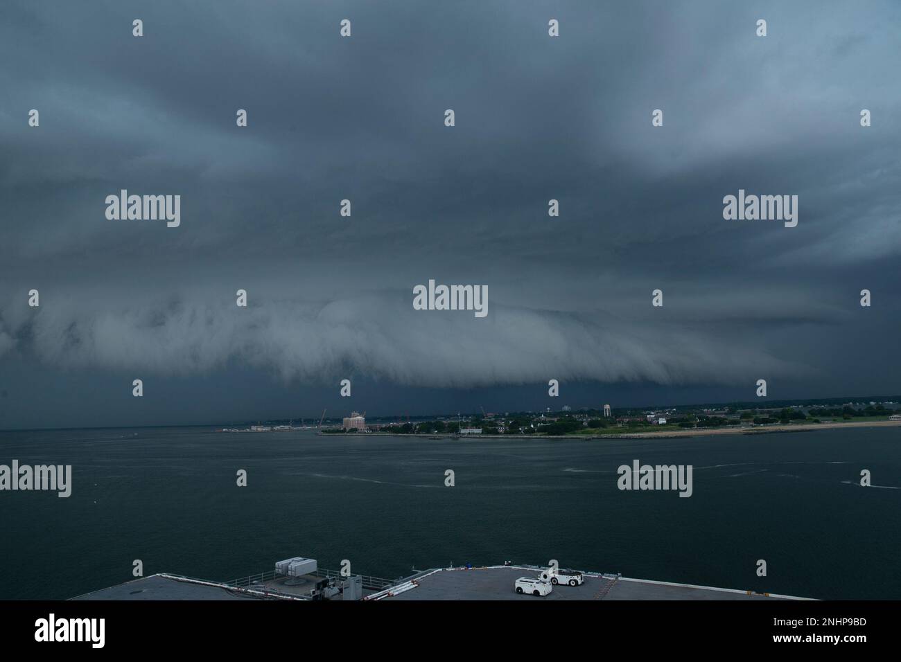 A thunderstorm travels over Hampton, Virginia, as USS Gerald R. Ford ...