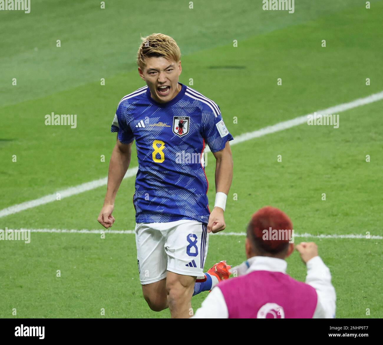 Ritsu Doan (8) of Japan reacts after scoring in the second half of the ...