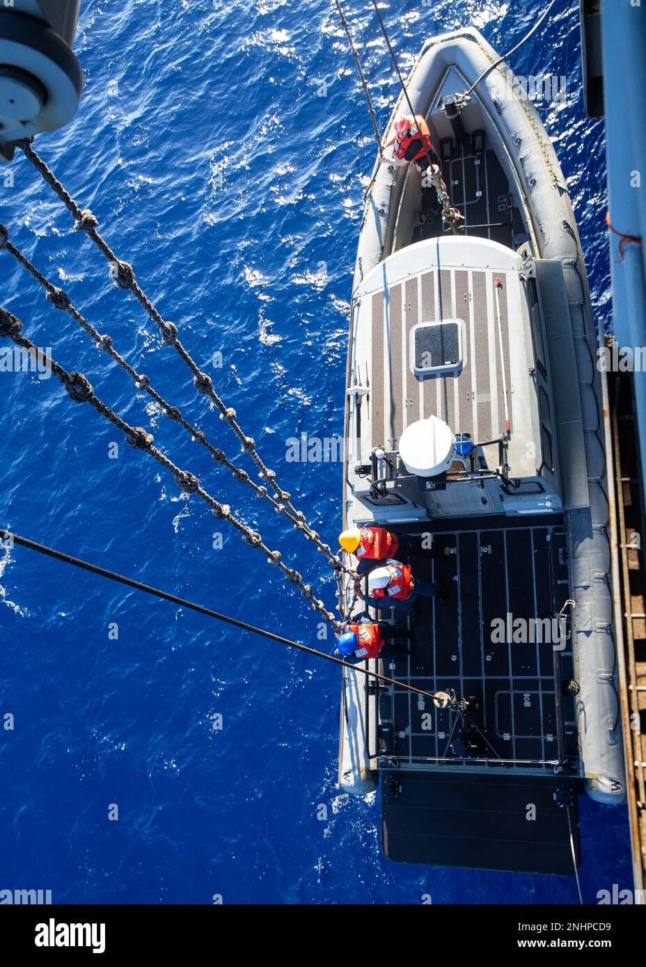 220802-N-CM110-1027 PACIFIC OCEAN (Aug. 2, 2022) – Sailors lower an 11 ...