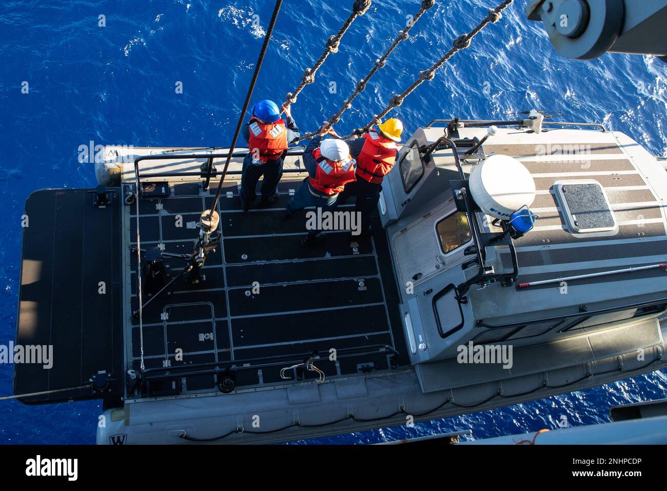 220802-N-CM110-1024 PACIFIC OCEAN (Aug. 2, 2022) – Sailors lower an 11 ...