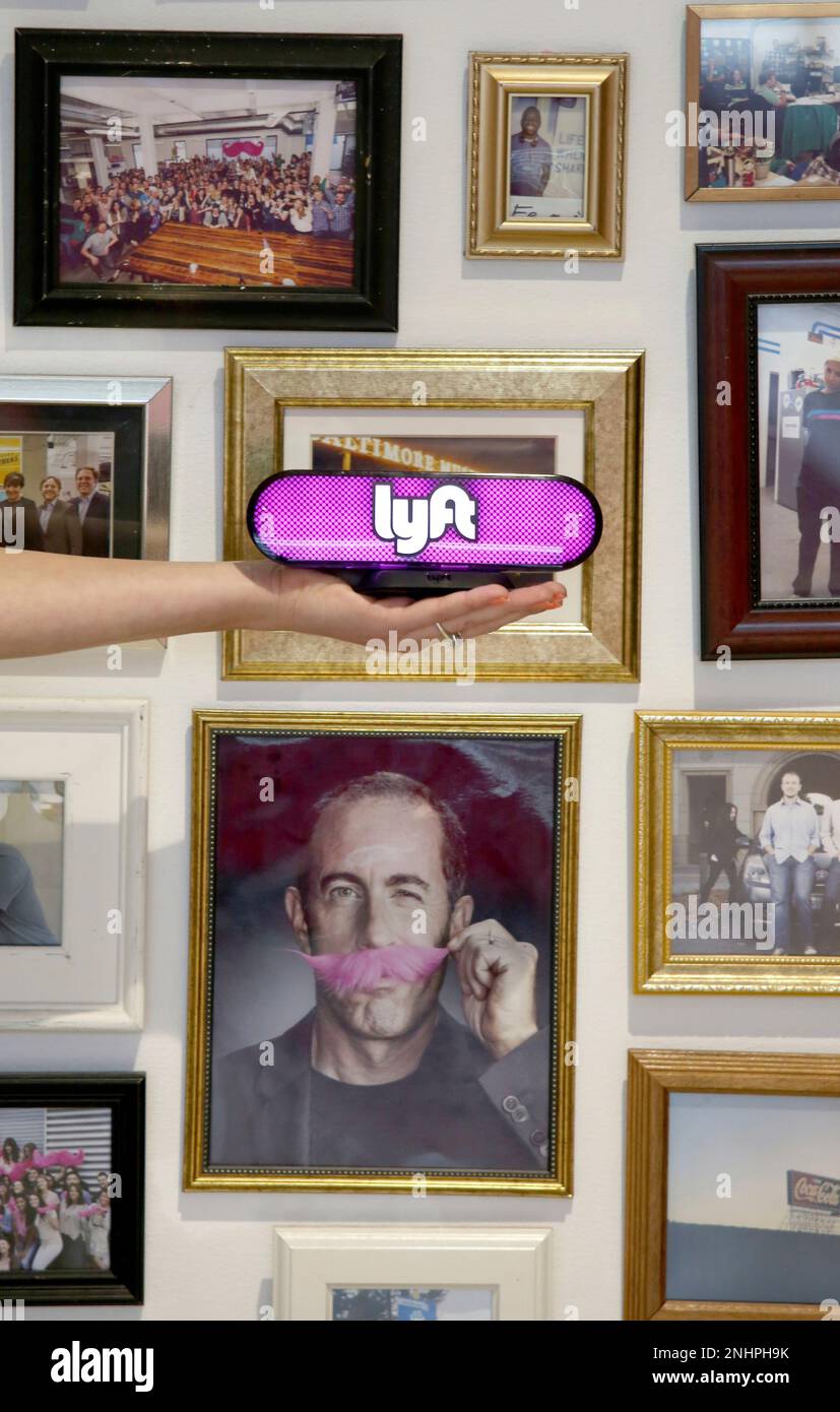 New Lyft logoon it's new dashboard device (turned on) making it easier ...