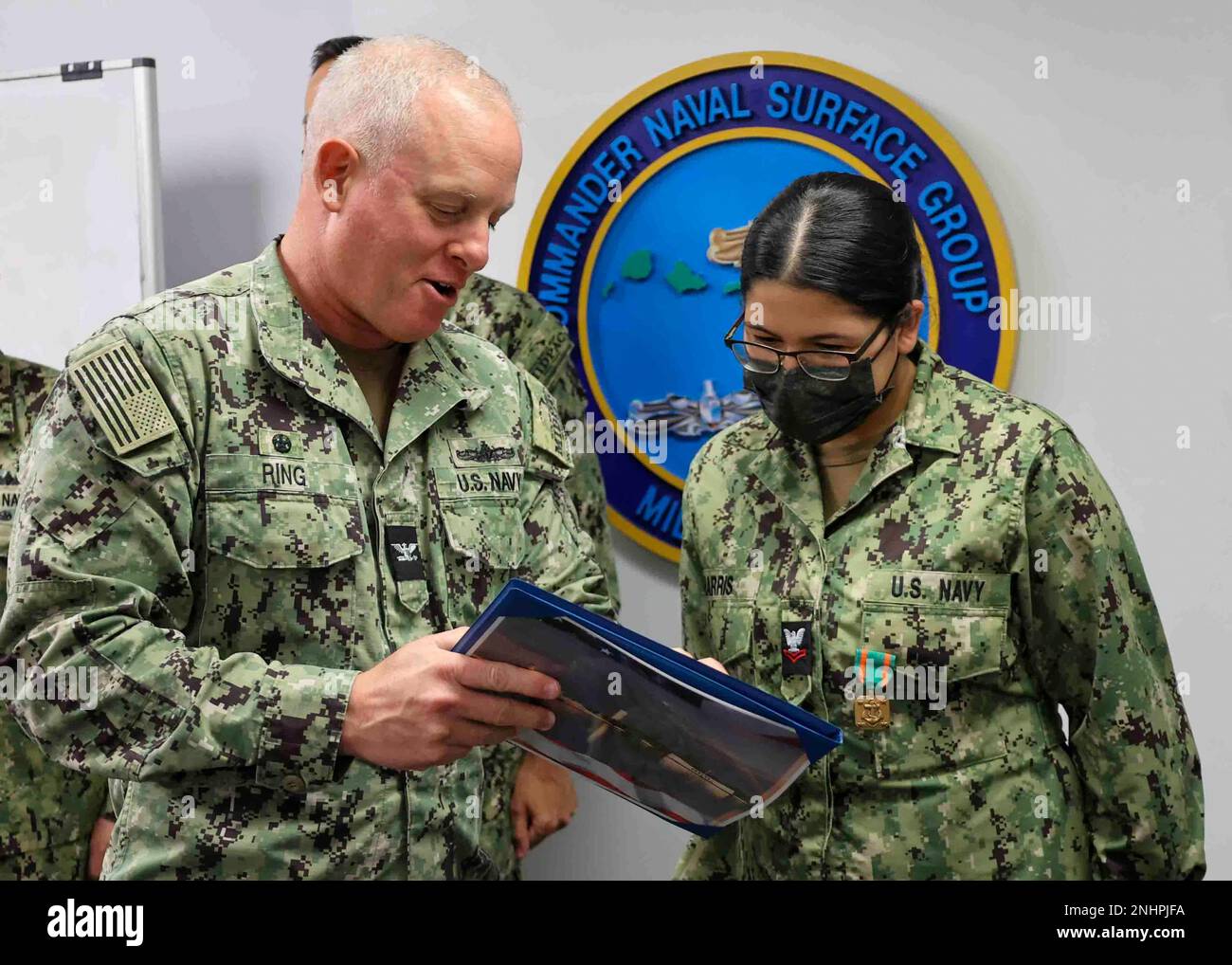 221227-N-RV233-1002 HM2 Harris receives a Navy and Marine Corps ...