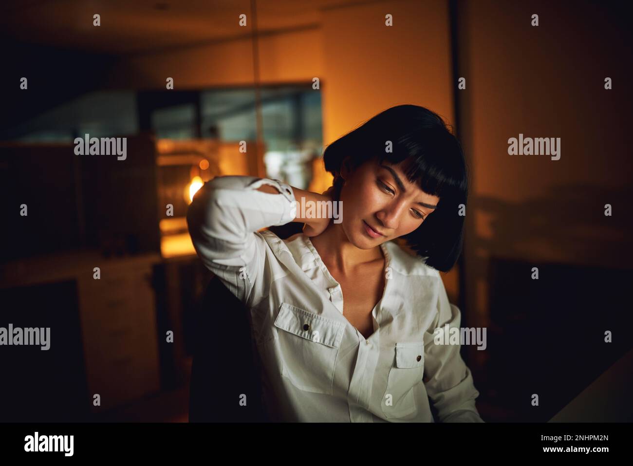 Taking some strain and pain. a young businesswoman experiencing strain ...