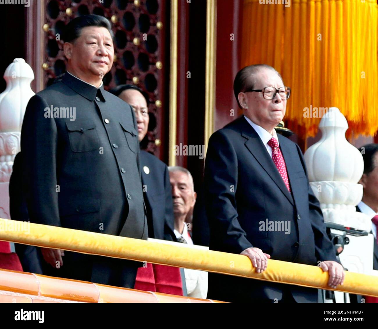 File- Former Chinese President Jiang Zemin (R) and current President Xi ...