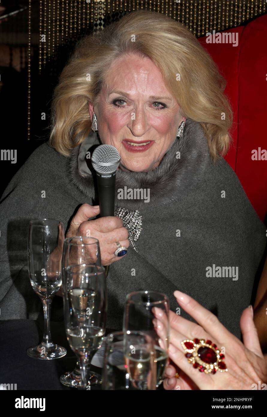 Social figure Sally Debenham in a gray cape and gunmetal pants by ...