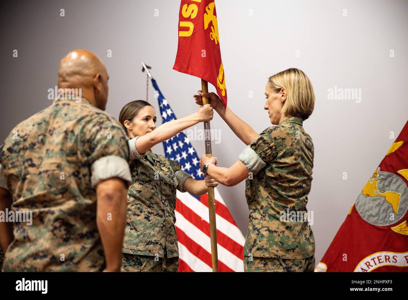 U.S. Navy Cmdr. Autumn Riddell, incoming company commander, receives ...