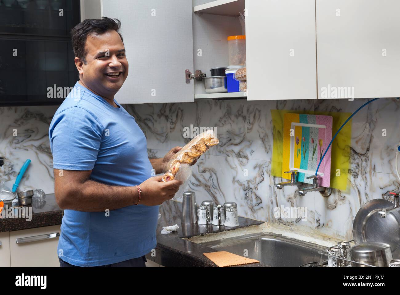 Working in kitchen hi-res stock photography and images - Alamy