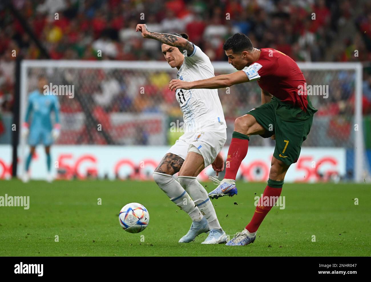Uruguay's Darwin NUNEZ struggles to stop Portugal's CRISTIANO RONALDO's shoot during the FIFA ...