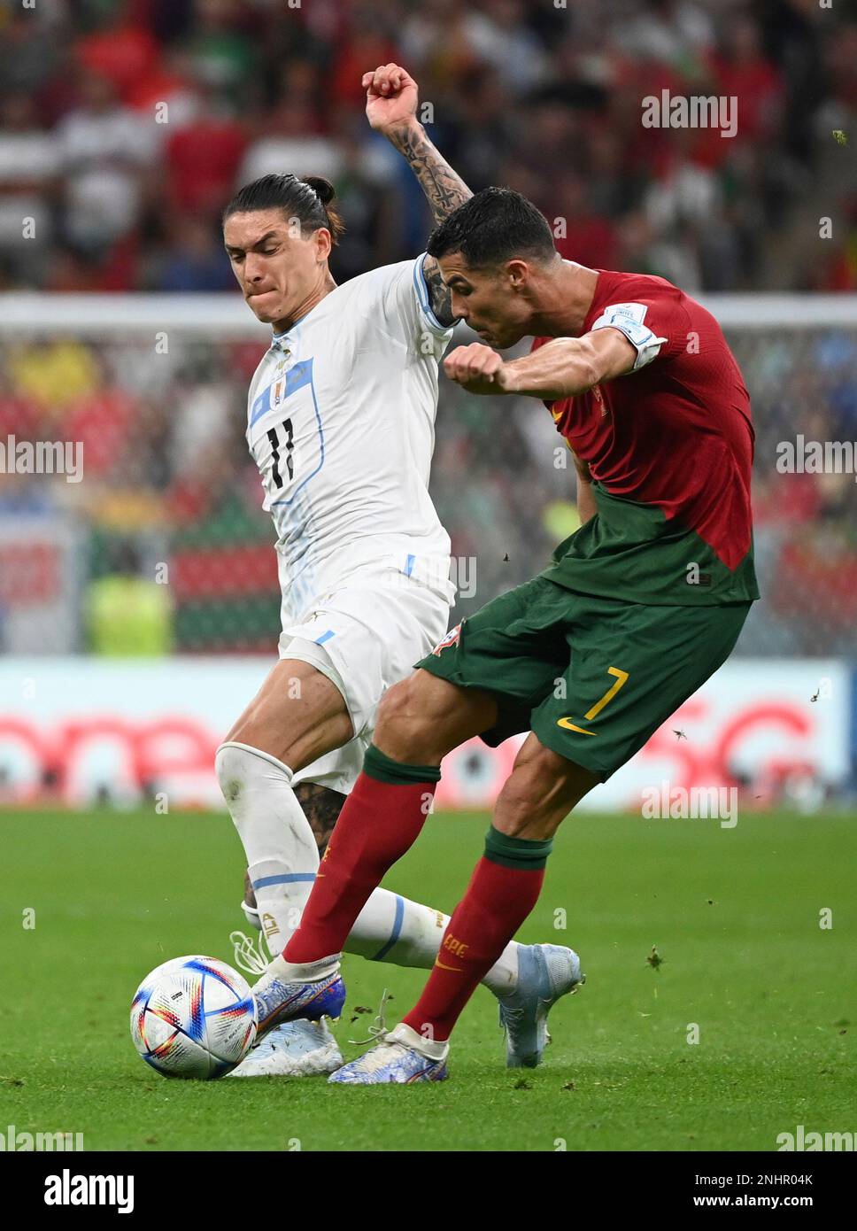 Uruguay's Darwin NUNEZ struggles to stop Portugal's CRISTIANO RONALDO's shoot during the FIFA ...
