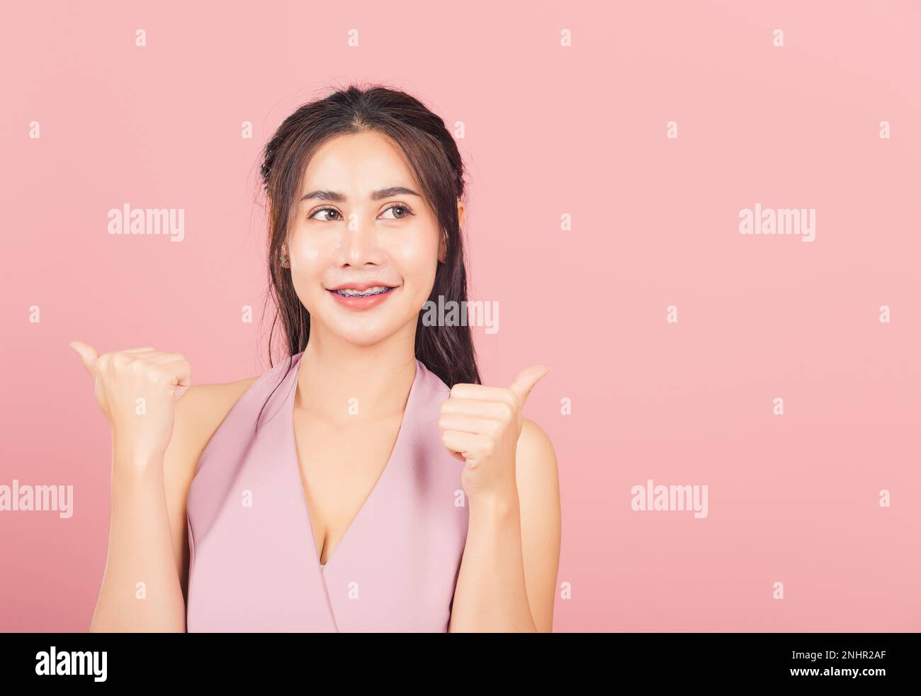 woman smile she standing made finger thumbs up Stock Photo - Alamy