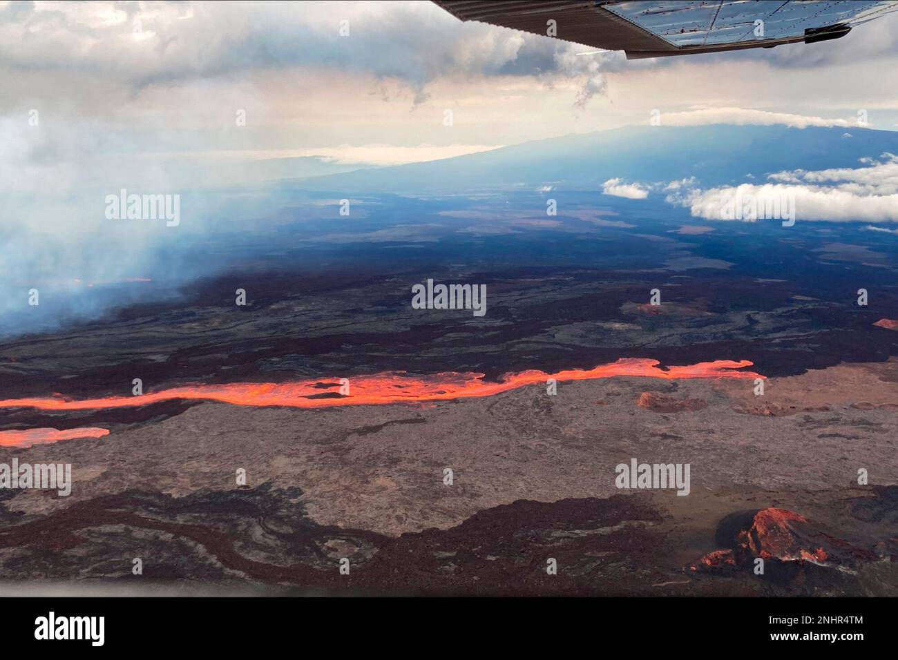 In this aerial photo released by the U.S. Geological Survey, the Mauna Loa volcano is seen ...