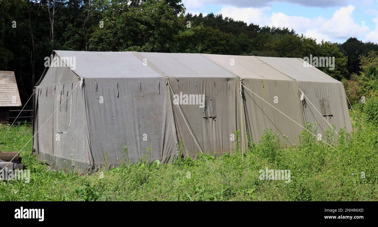 Green military tent set up in the forest Stock Photo - Alamy
