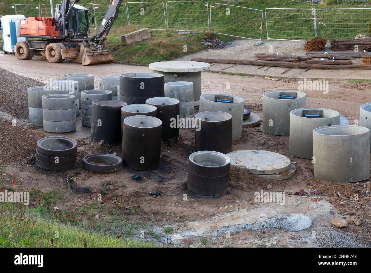 New concrete rings for wells and sewer on construction site Stock Photo ...