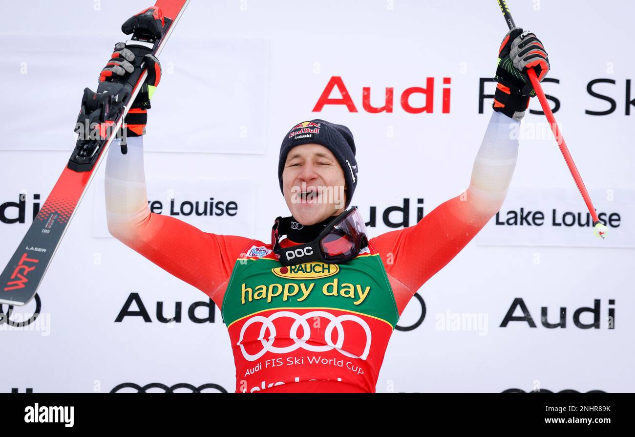 Switzerland's Marco Odermatt celebrates his victory on the podium ...