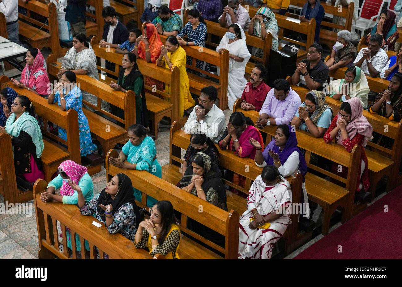 Catholics offer prayers during a mass in observance of Ash Wednesday at ...