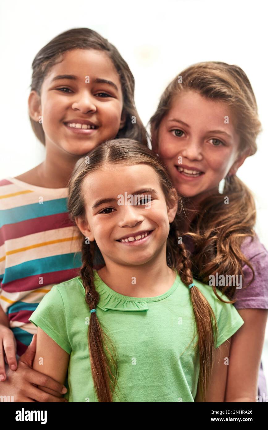 Three peas in a pod. Cropped portrait of three young girls standing ...