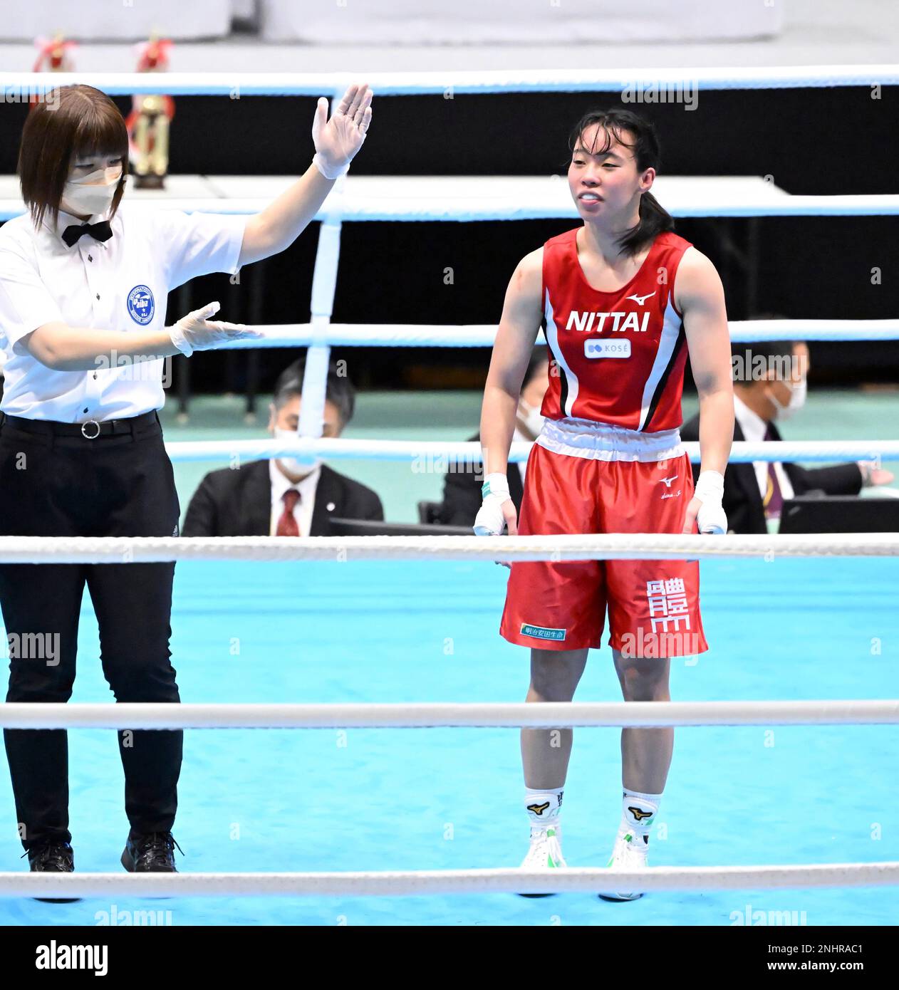 Japanese boxer Sena Irie (red) reacts after winning the women's featherweight final match of ...