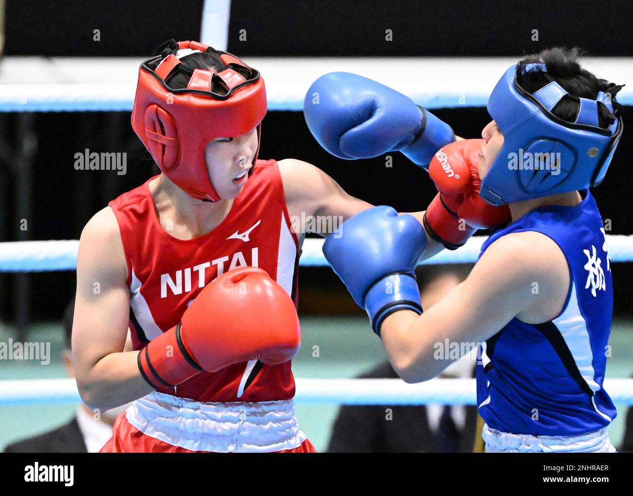 Japanese boxer Sena Irie (red) delivers a punch during the women's ...