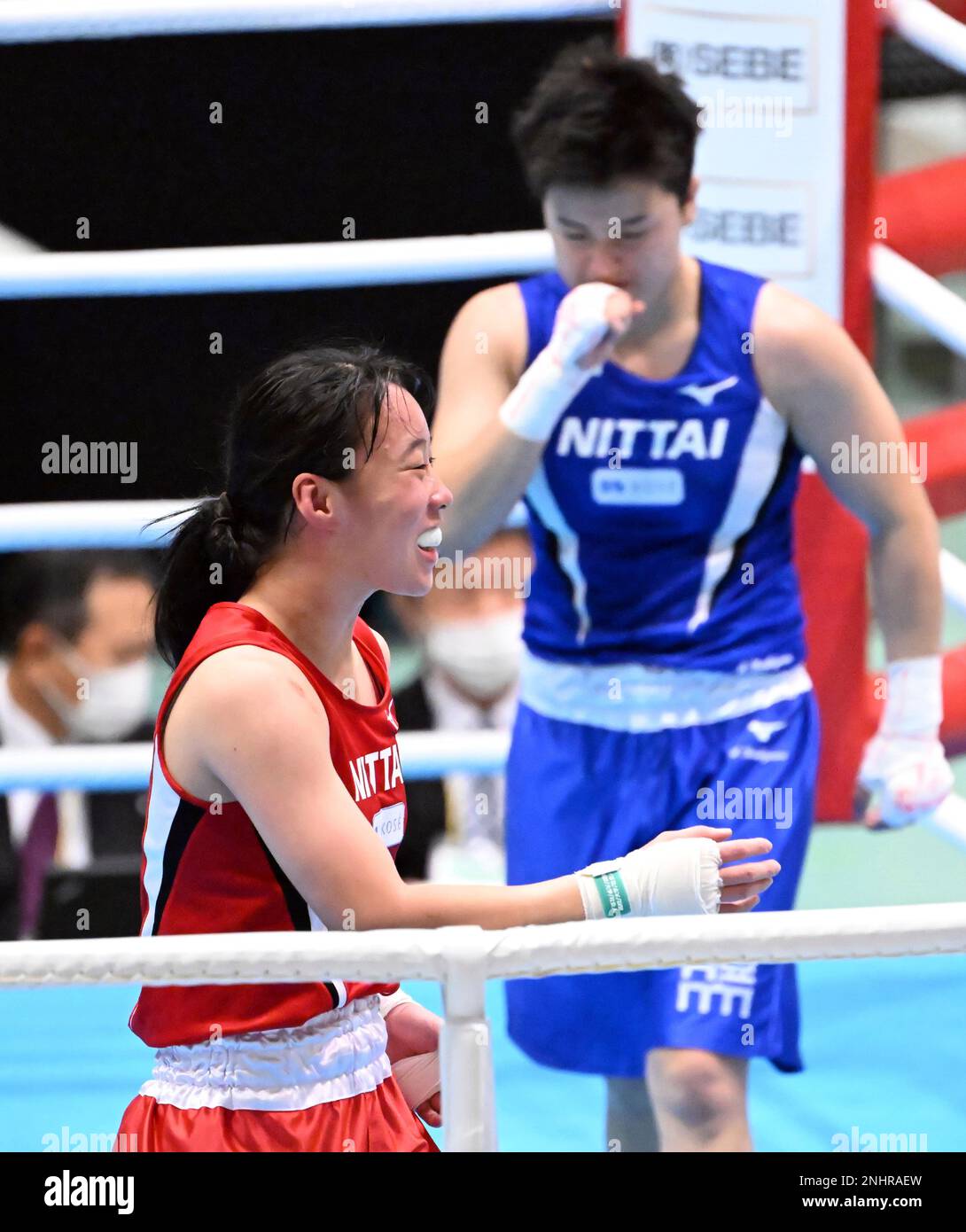 Japanese boxer Sena Irie (red) reacts after winning the women's featherweight final match of ...