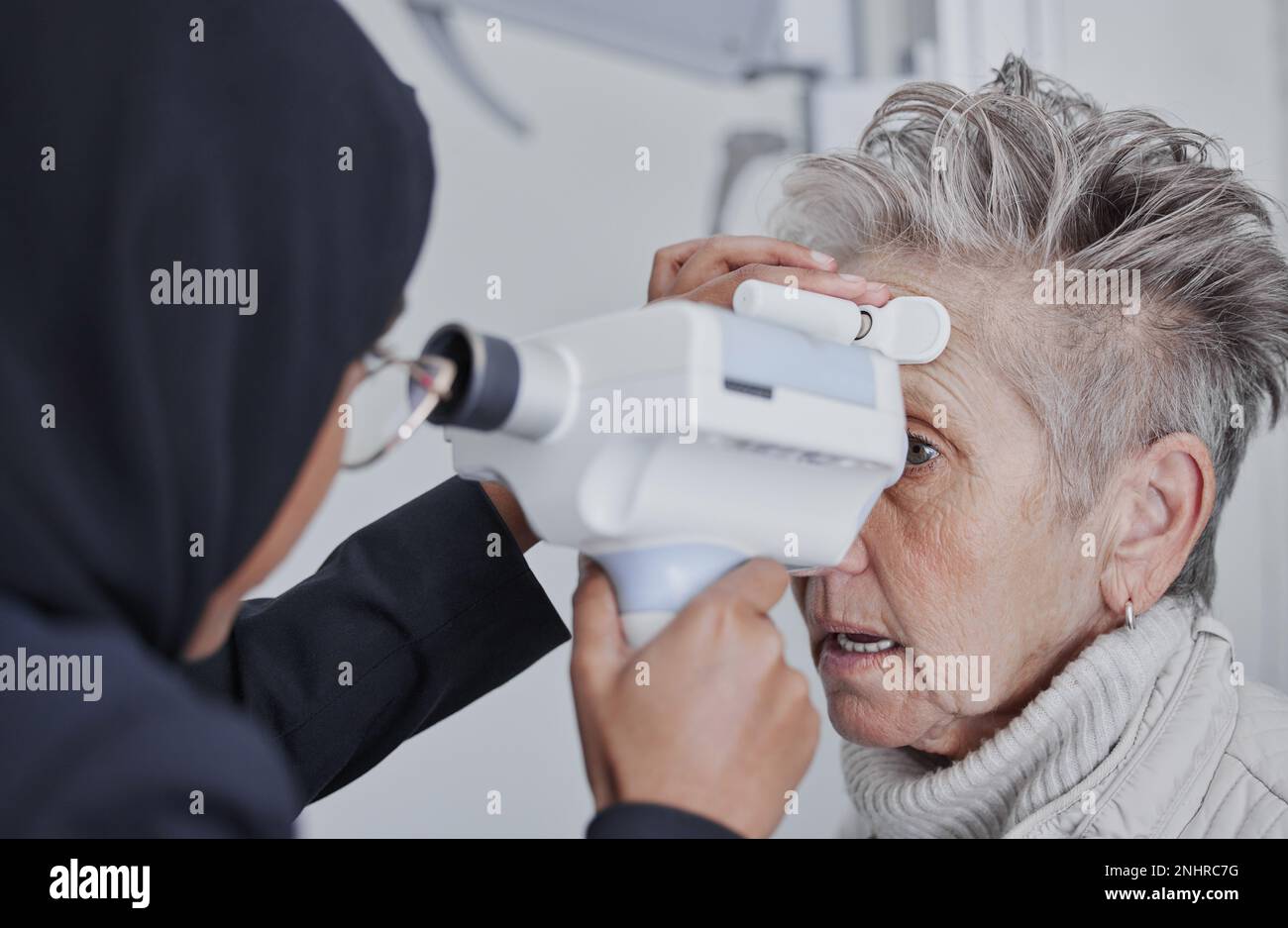 Optometrist, eye test and senior woman patient in healthcare checkup ...