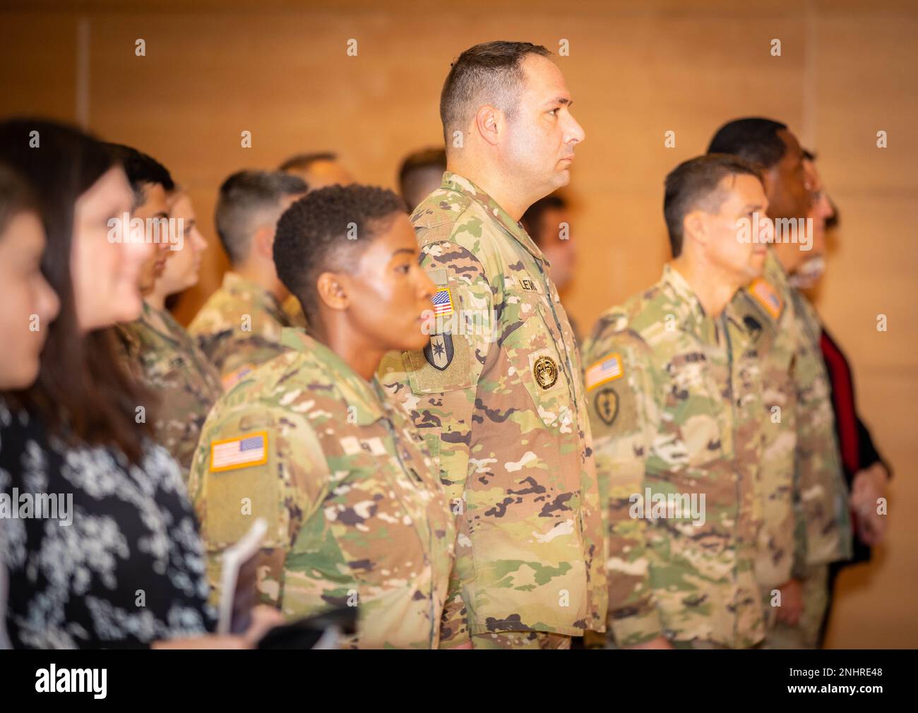 CPT Shanee Allen, MSG Matthew Lewis and Commnder Chad Koenig stand for ...