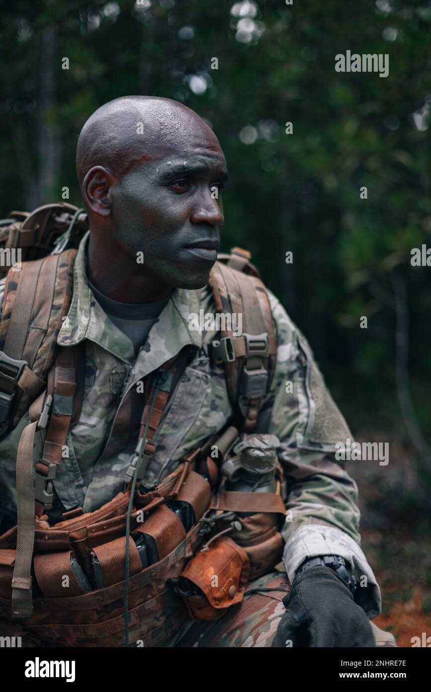 A U.S. Soldier attending the Small Unit Ranger Tactics course waits at ...