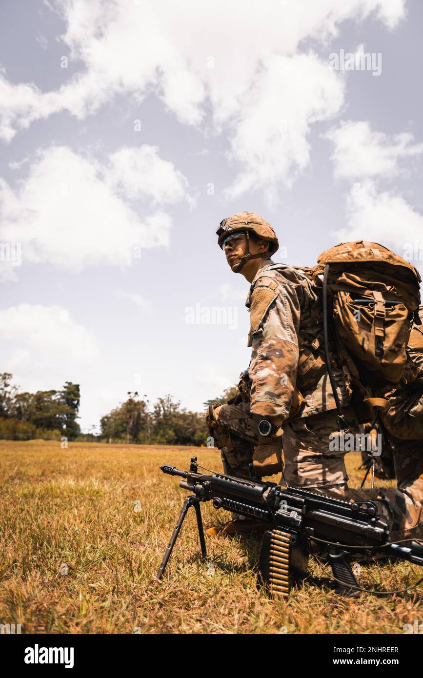 U.S. Soldier attending the Small Unit Ranger Tactics course waits at an ...
