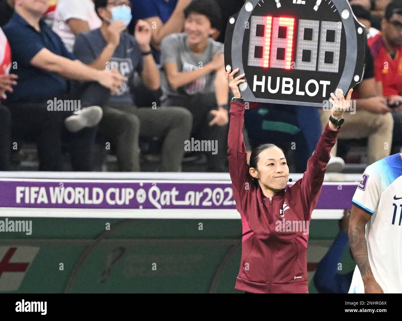 Japan's female referee Yoshimi Yamashita holds a board during the FIFA ...