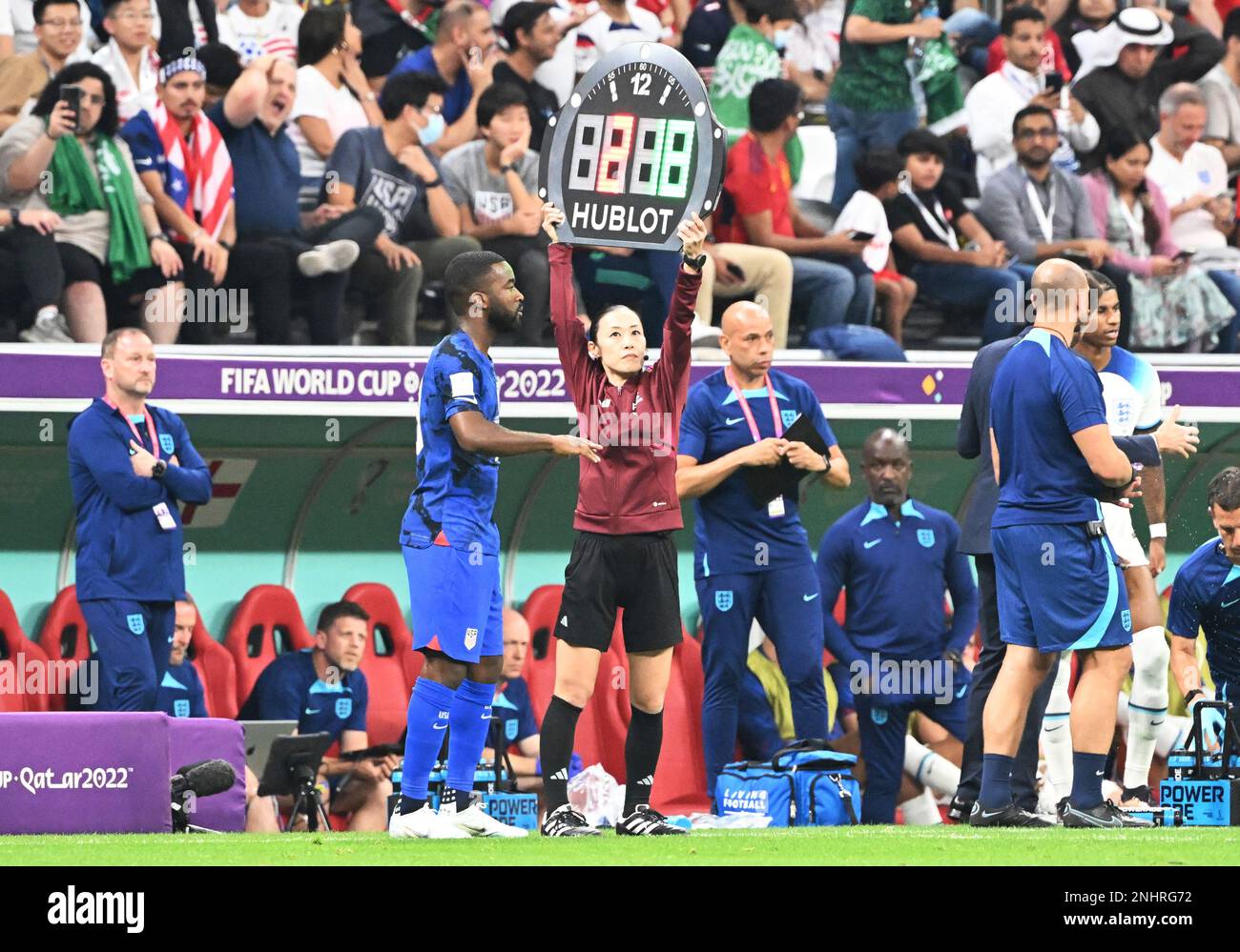 Japan's female referee Yoshimi Yamashita holds a board during the FIFA ...