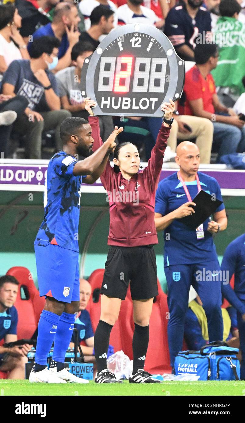 Japan's female referee Yoshimi Yamashita holds a board during the FIFA ...
