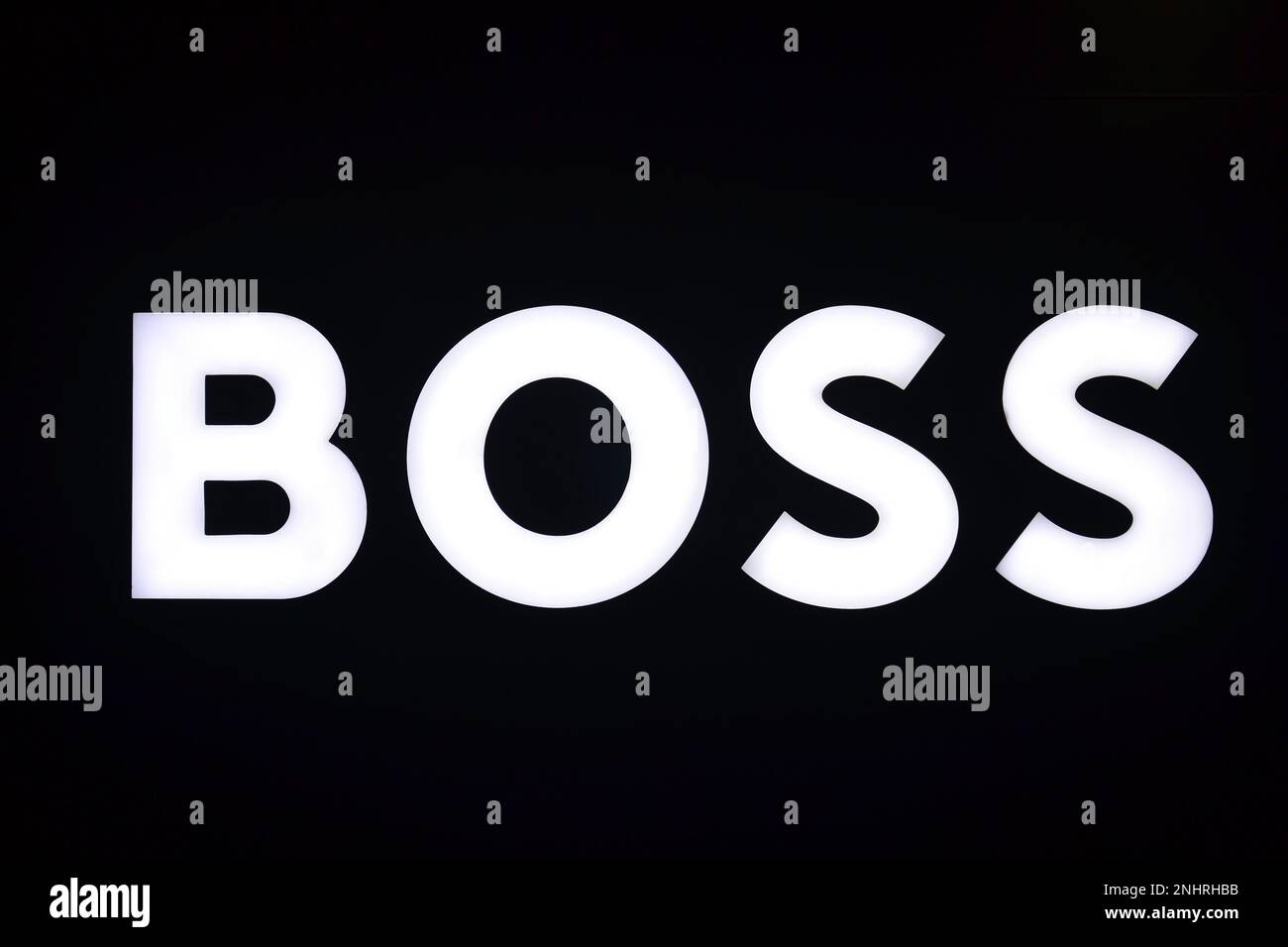 A sign says 'BOSS' in capital letters on a black background Stock Photo ...