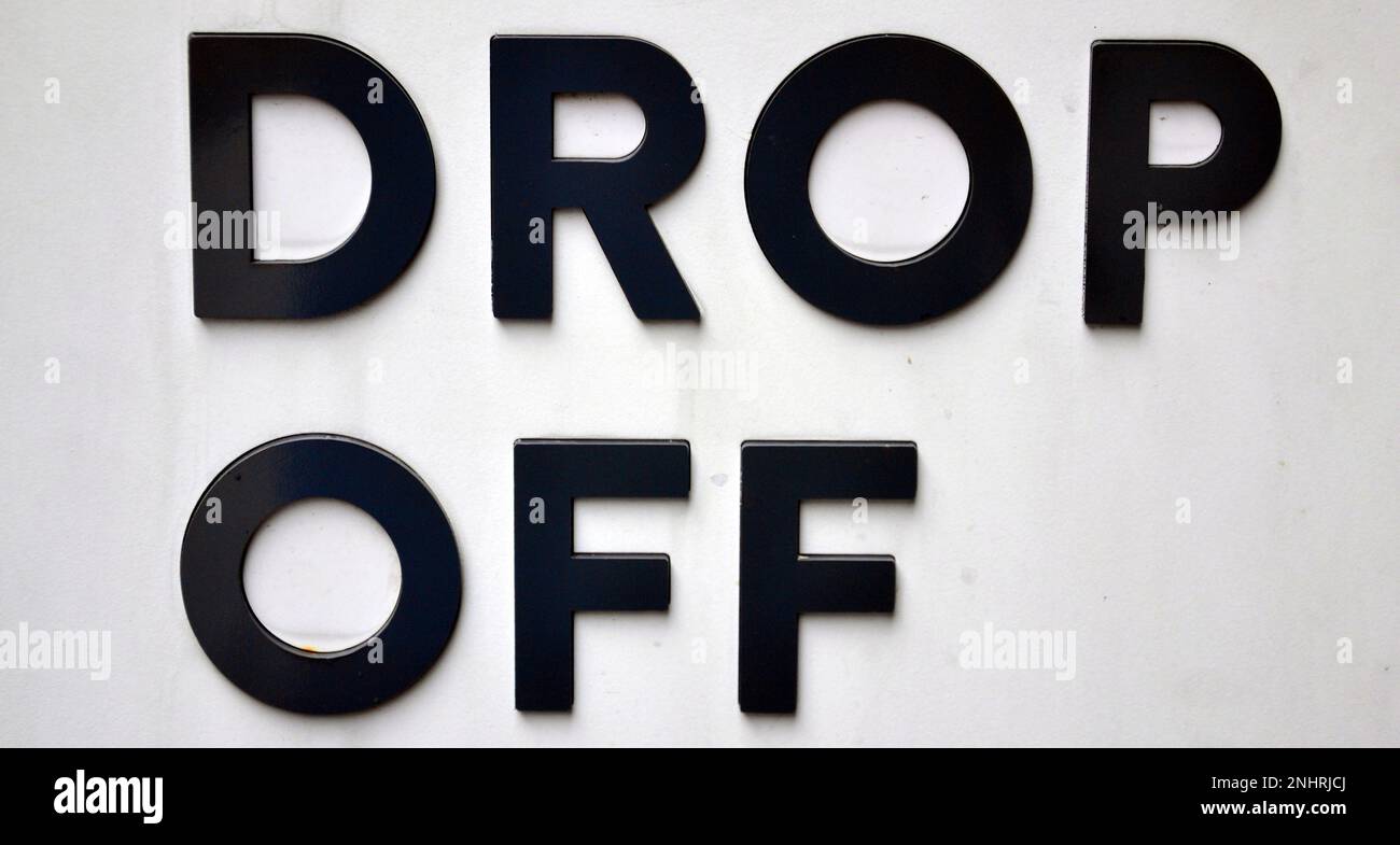 A sign says 'DROP OFF' in capital letters Stock Photo - Alamy