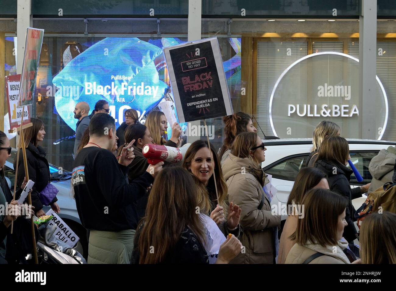 Workers demonstrate with banners in front of Pull store 25 NOVEMBER ...