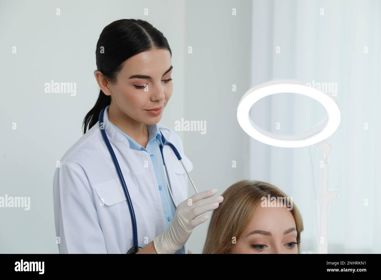 Dermatologist examination young woman hi-res stock photography and ...
