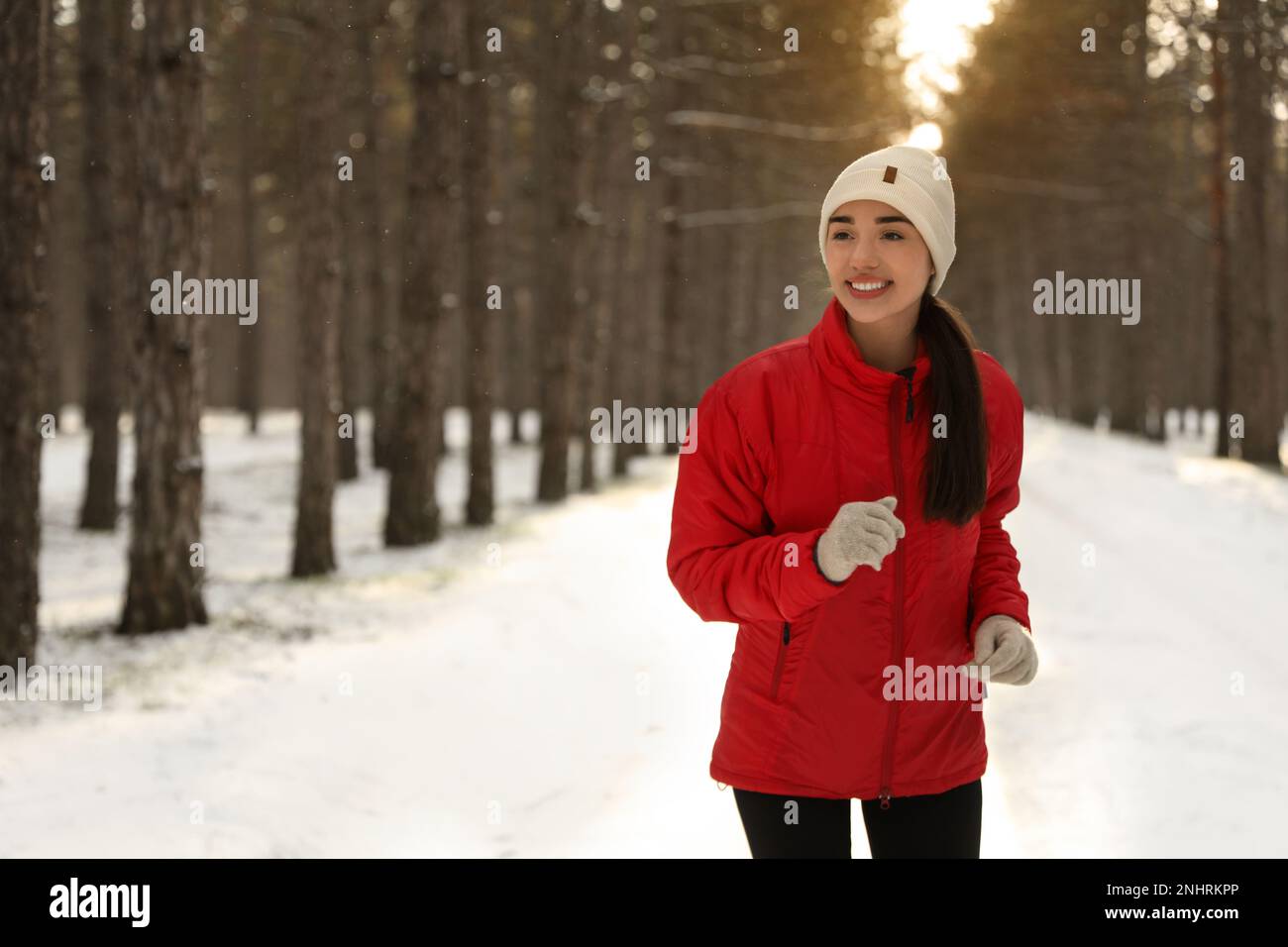 Happy woman running in winter forest. Outdoors sports exercises Stock ...