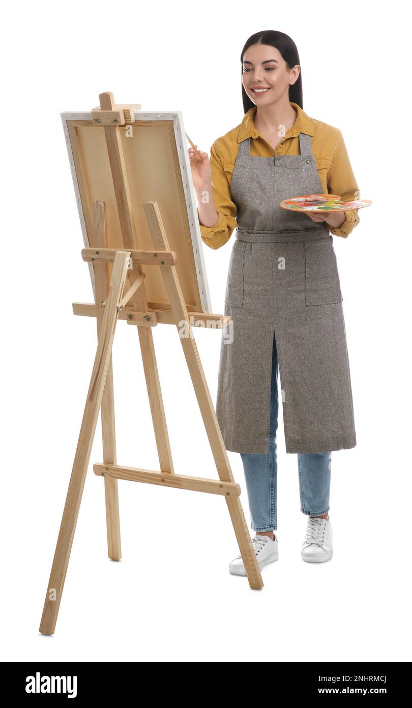 Young woman drawing on easel against white background Stock Photo - Alamy