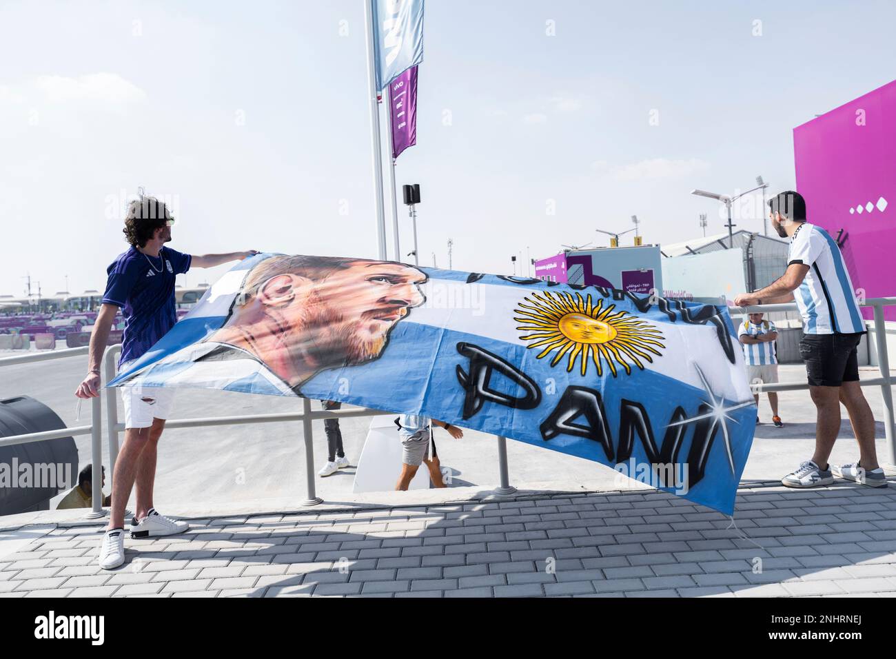 LUSAIL, QATAR - NOVEMBER 22: Fans wave a banner with a painting of ...