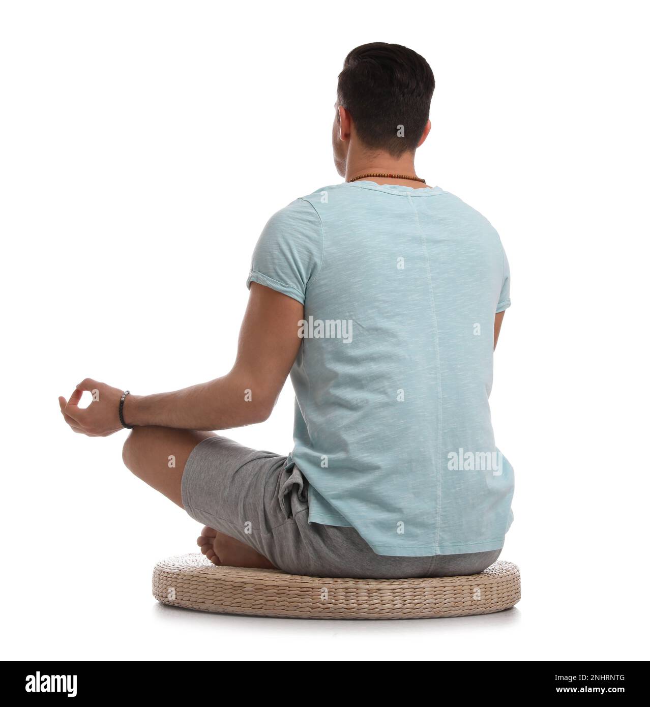 Man meditating on white background, back view Stock Photo - Alamy