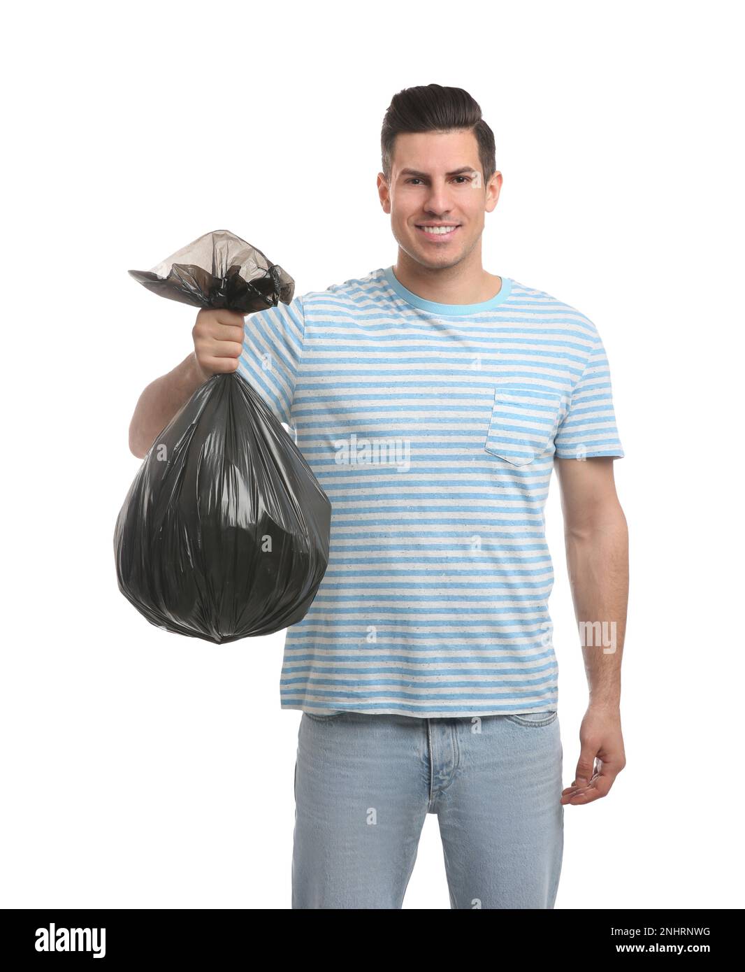 Man holding full garbage bag on white background Stock Photo - Alamy