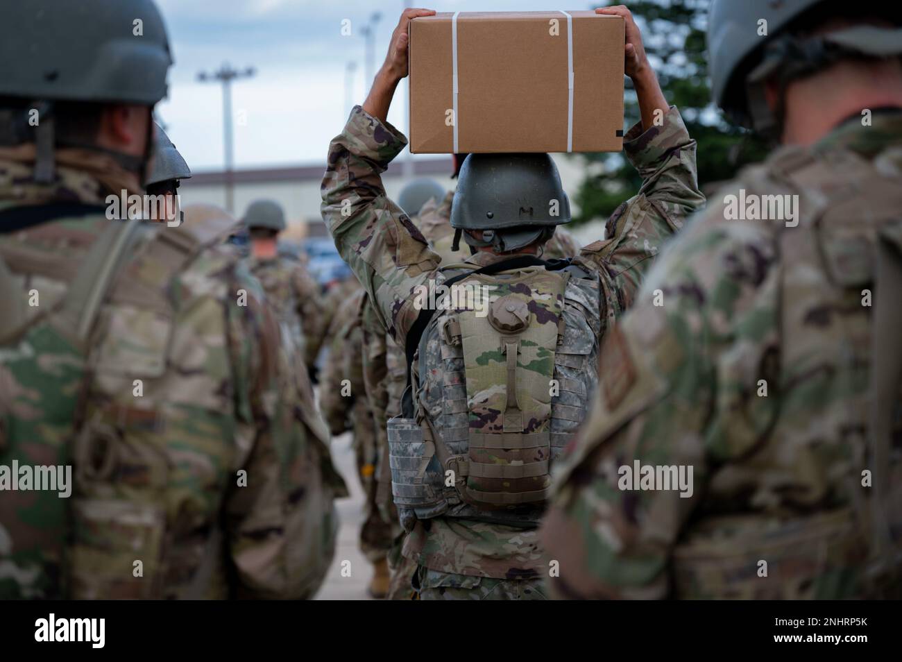 U.S. Air Force Airmen carry supplies to a training lane during ...