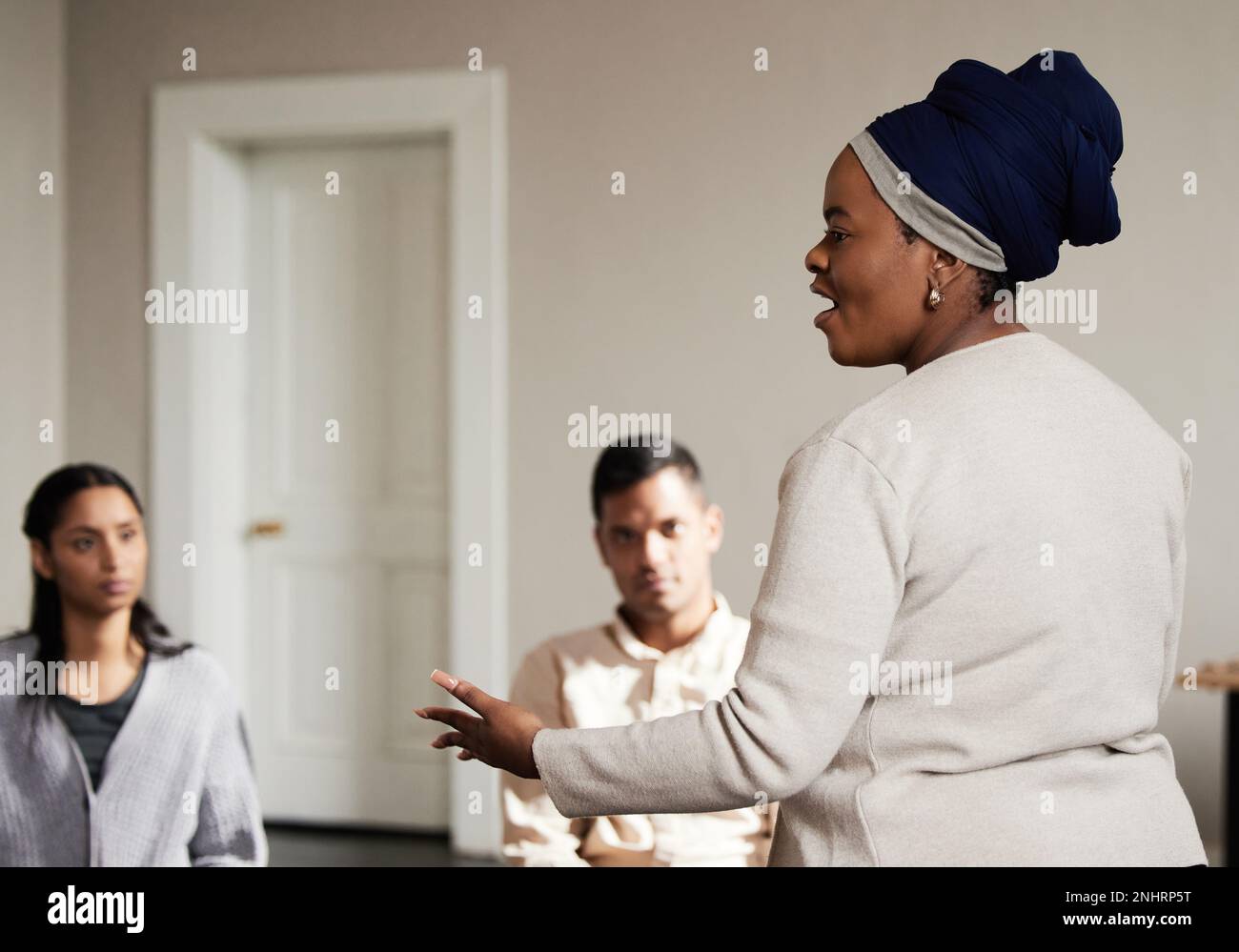 Talking, black woman and group of people in therapy with understanding ...