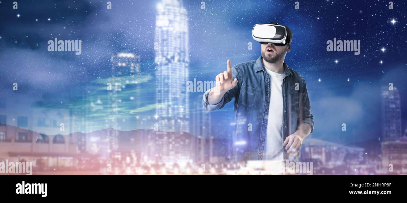 Man using virtual reality headset and getting in simulated futuristic ...