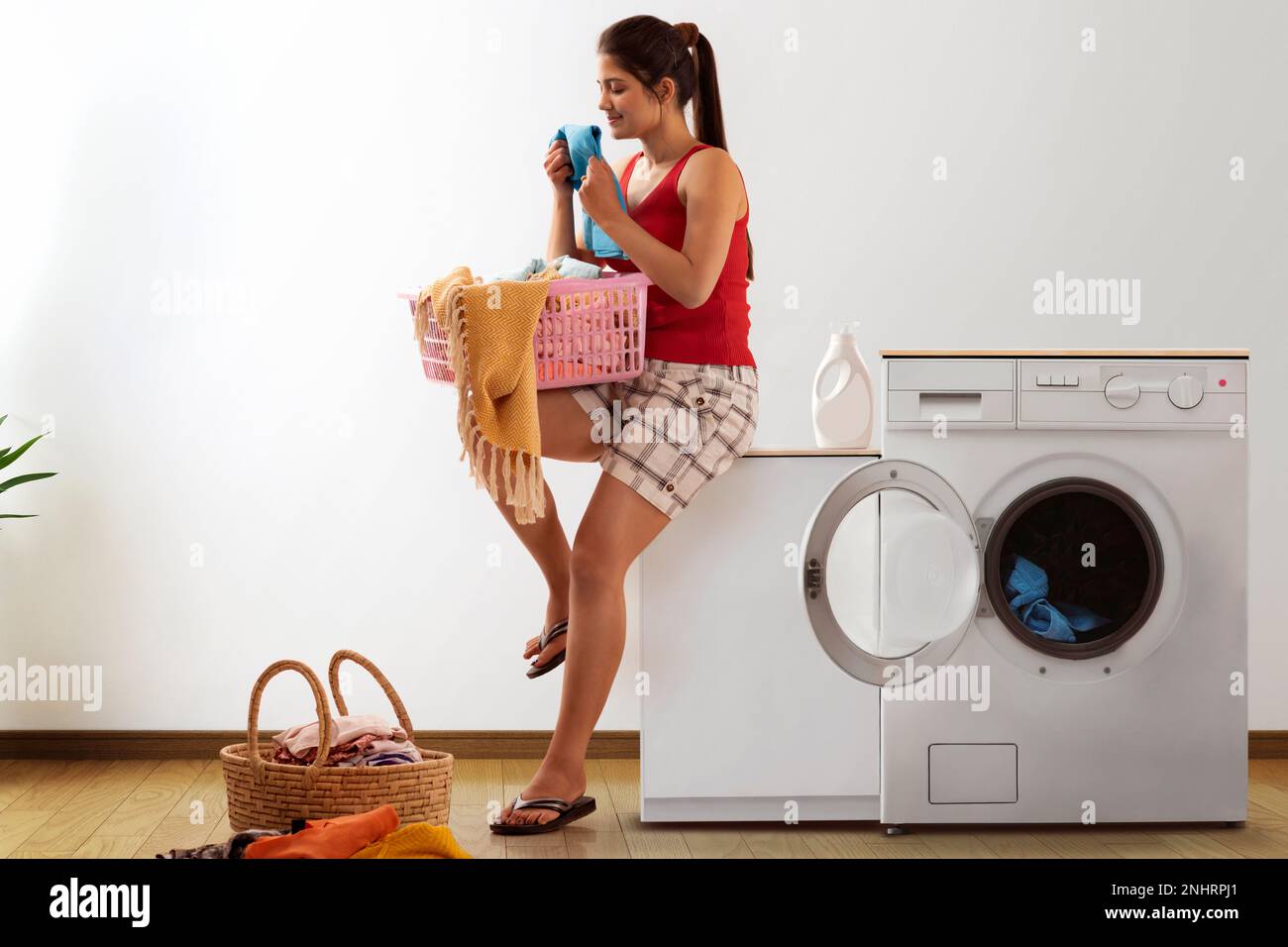 Indian woman washing clothes machine hi-res stock photography and images - Alamy