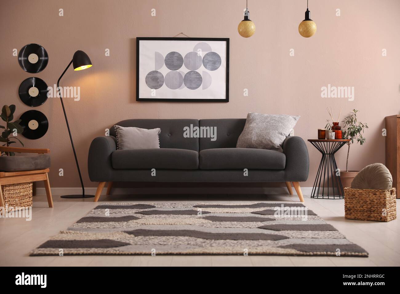 Stylish living room interior with comfortable dark sofa Stock Photo - Alamy