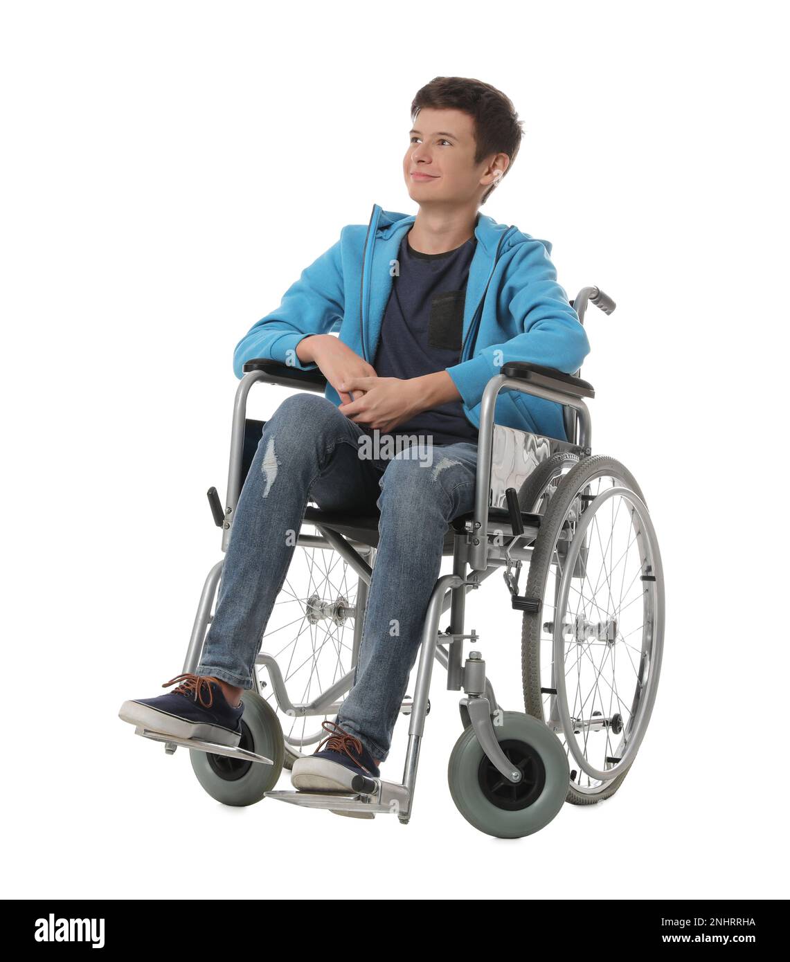 Teen boy in wheelchair on white background Stock Photo - Alamy