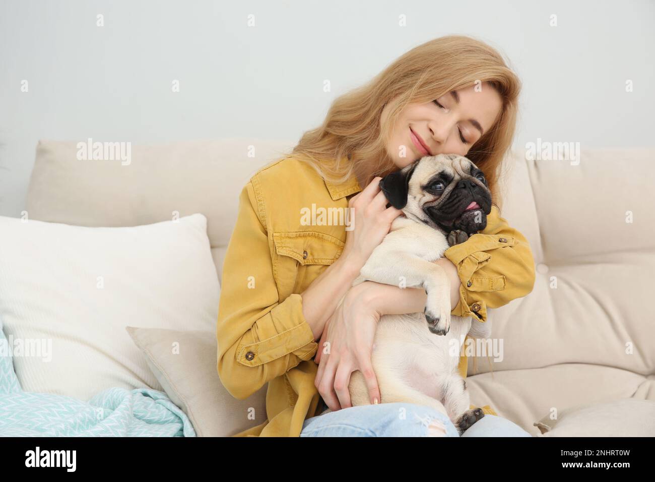 Woman holding pet pug hi-res stock photography and images - Alamy