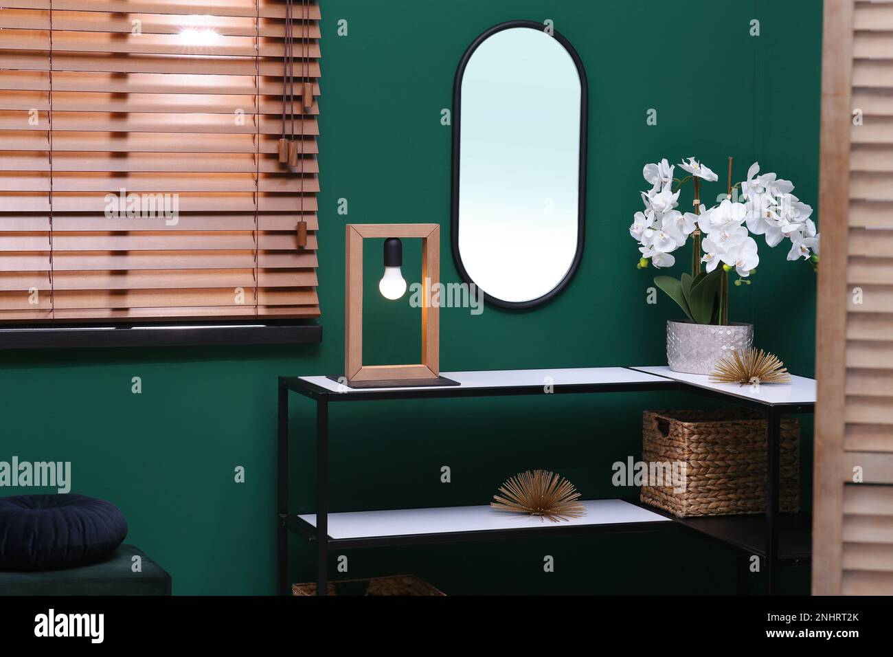 Modern hallway interior with console table and beautiful orchid flower ...