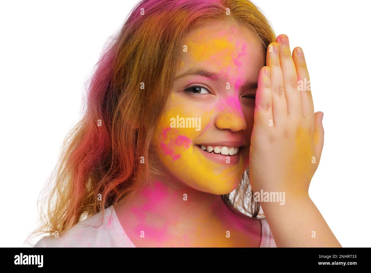 Teen girl covered with colorful powder dyes on white background. Holi ...