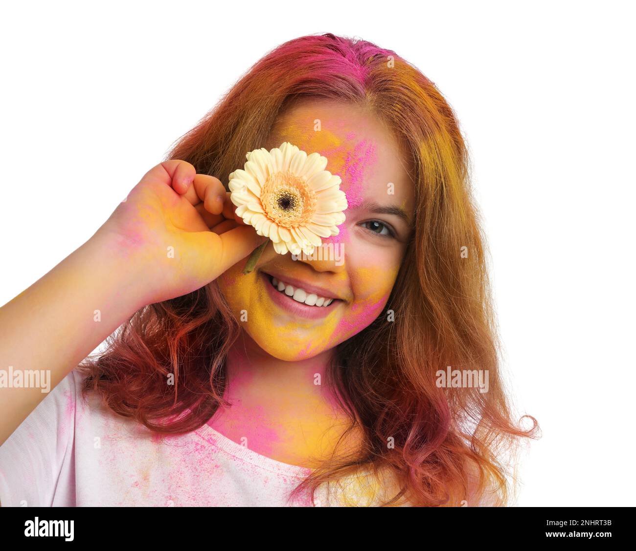 Teen girl covered with colorful powder dyes holding flower on white ...