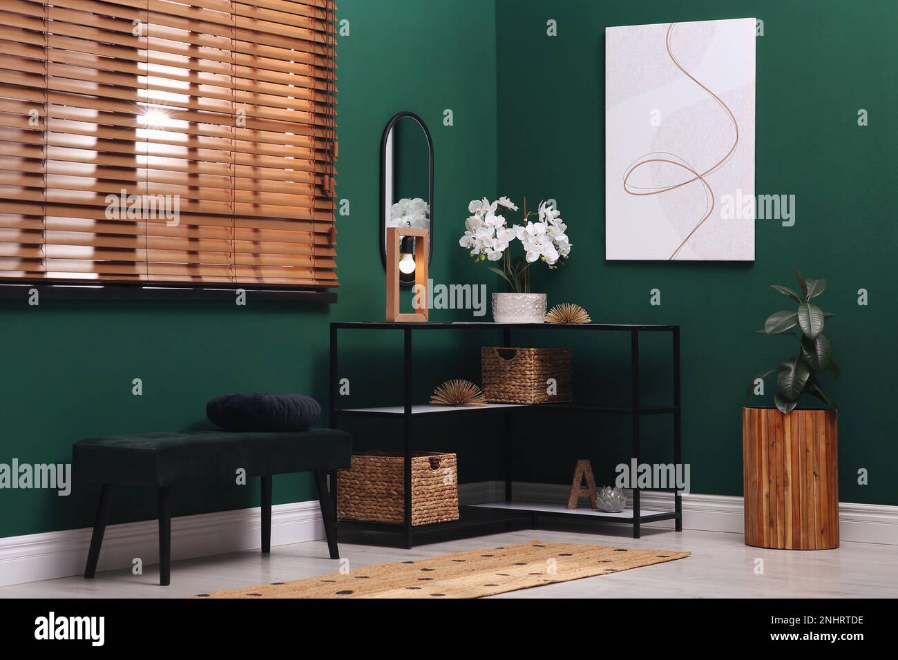 Modern hallway interior with beautiful orchid flower on console table ...
